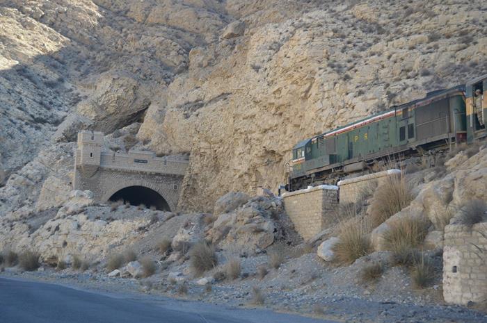 Photo - a view of train and tunnel located in bolan pass by lescol ...